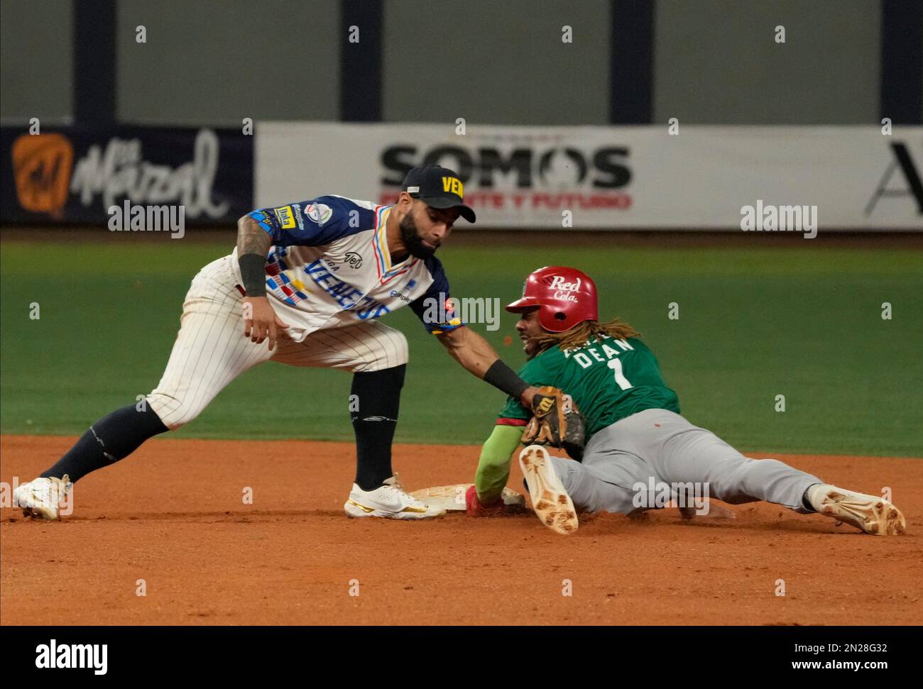 Mexico's outfielder Justin Dean, ground, slides safely into second base ...