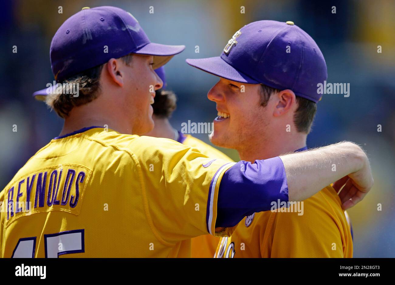 LSU pitcher Jared Poche' hugs pitcher Russell Reynolds after defeating ...
