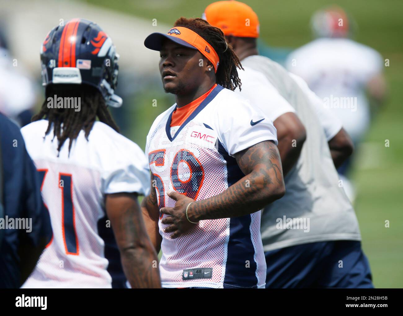 Denver Broncos inside linebacker Danny Trevathan, center, looks on ...