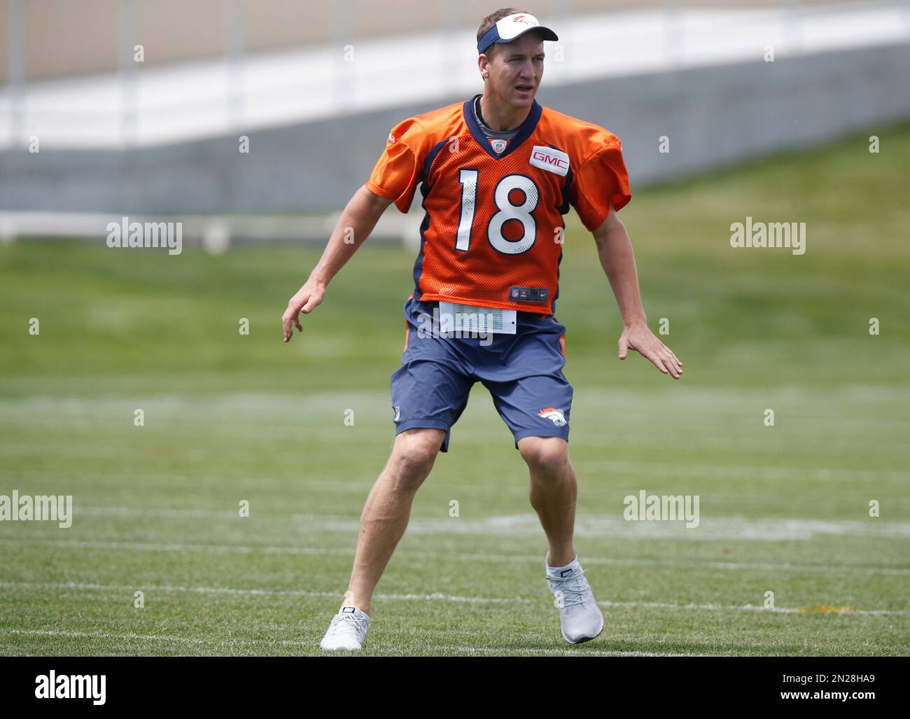 Denver Broncos quarterback Peyton Manning takes part in a drill during ...