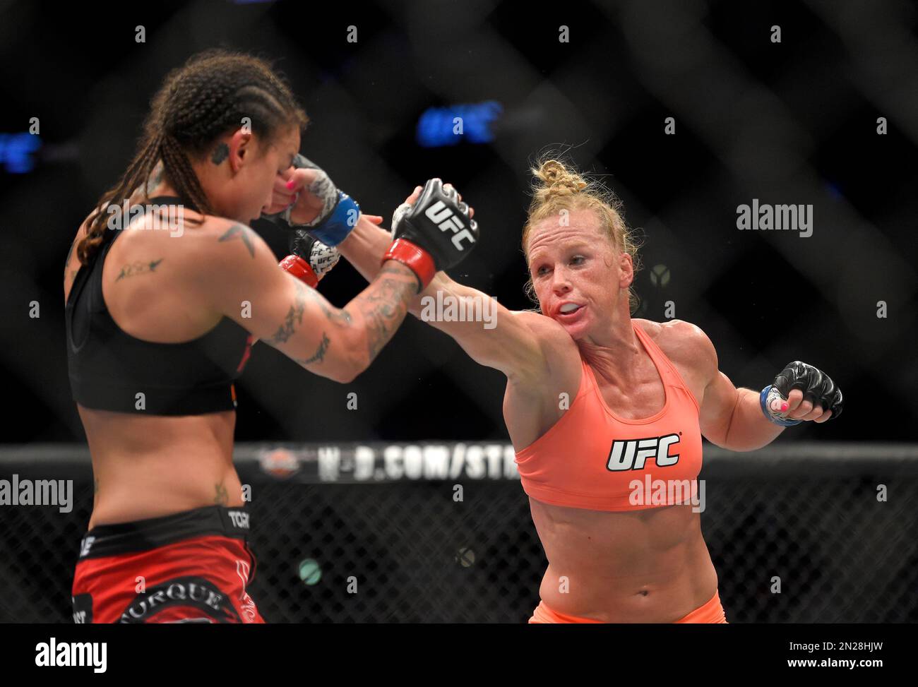 FILE - This Feb. 28, 2015 file photo shows Holly Holm, right, connects ...