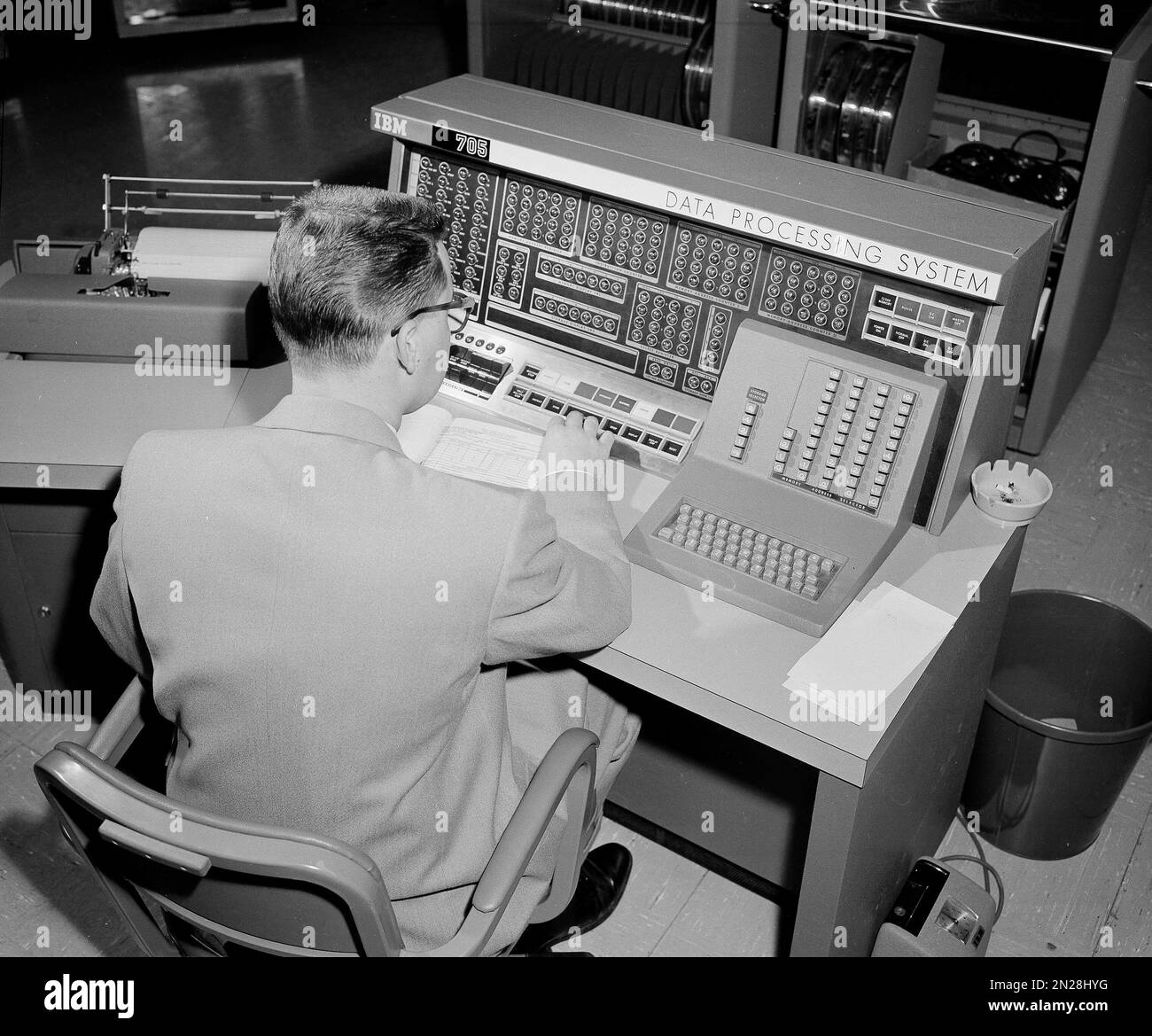 Owen Charles console operator for the electronic data processing system ...