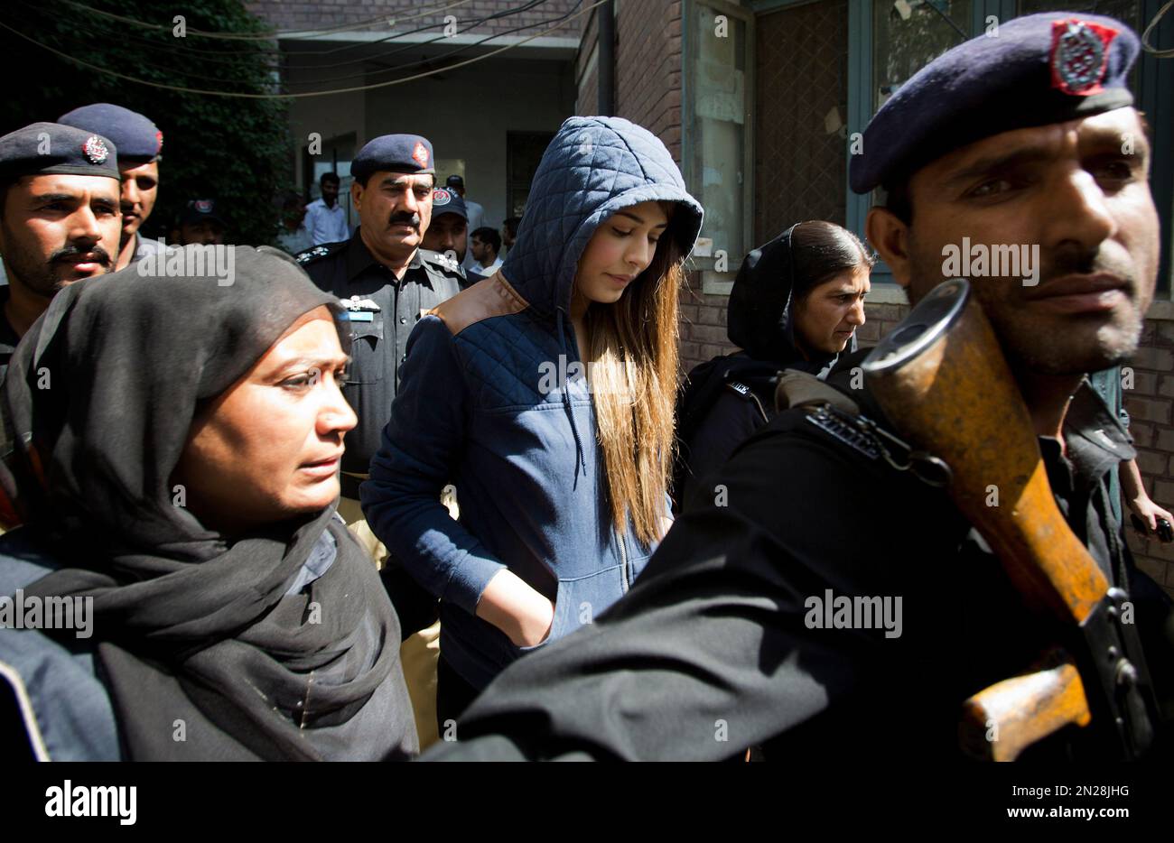 Pakistan's top model, Ayaan Ali, center, arrives in tight security to ...