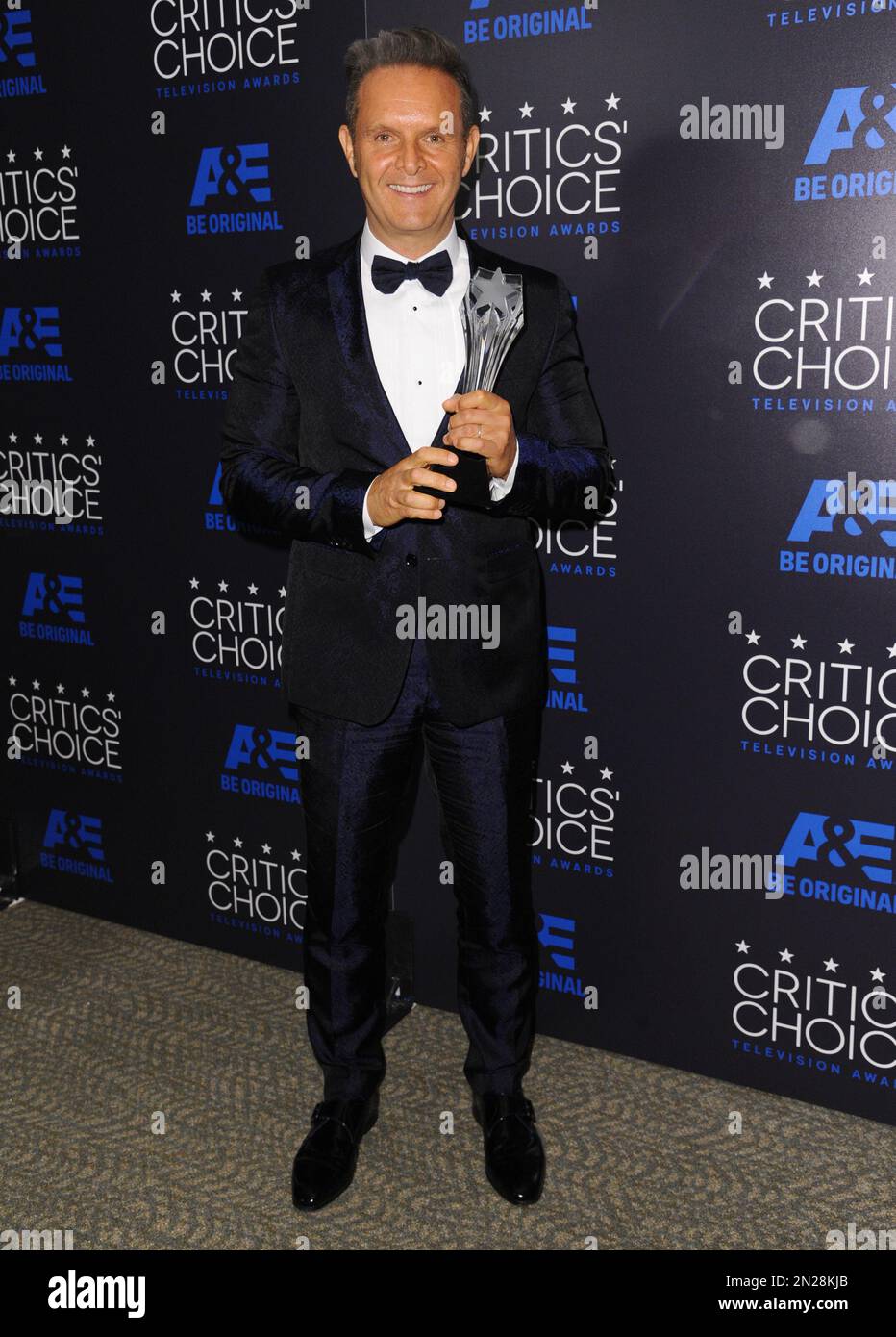 Mark Burnett poses in the press room with the award for best reality ...