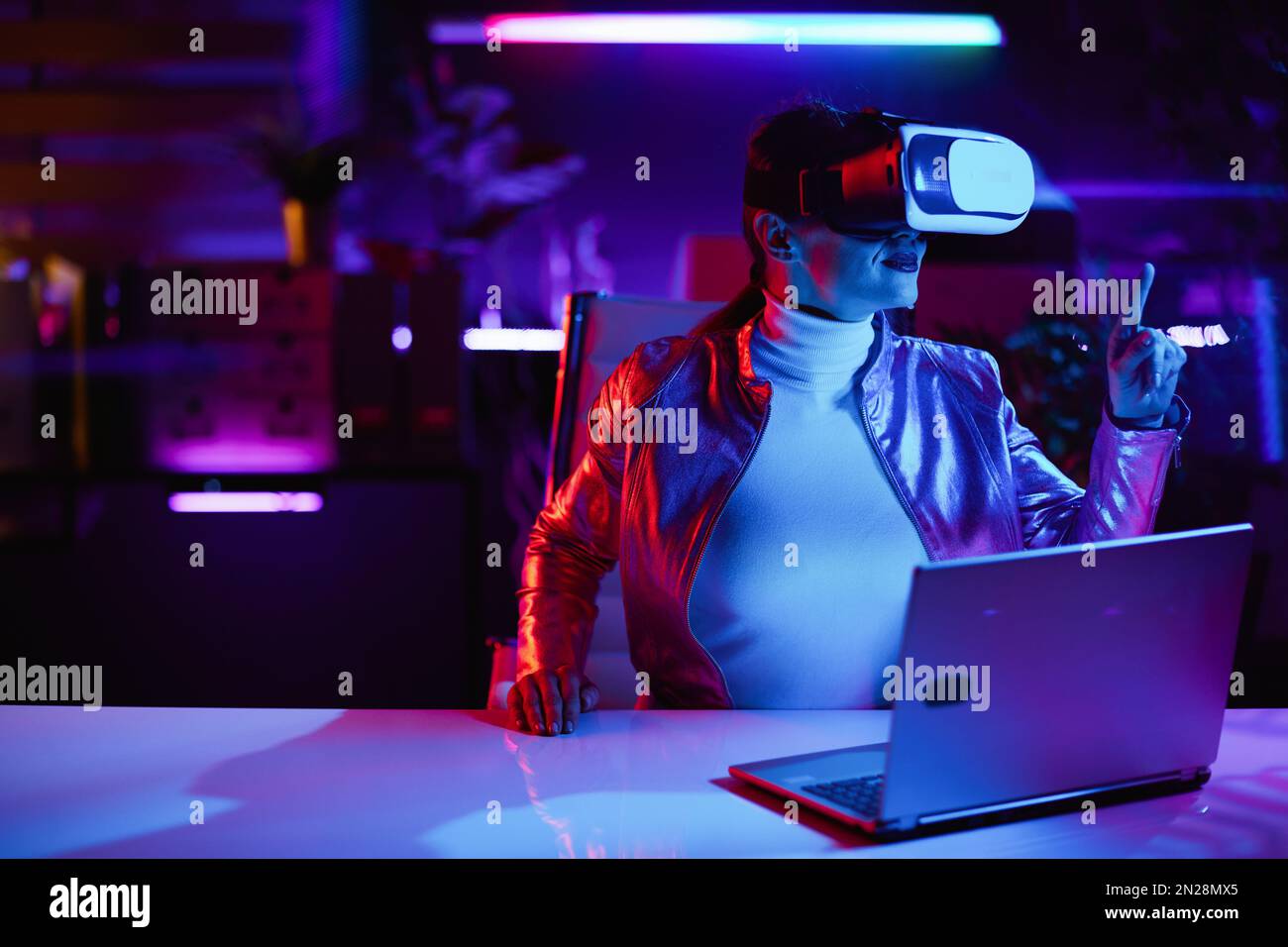 Neon metaverse futuristic concept. smiling stylish female in vr headset ...