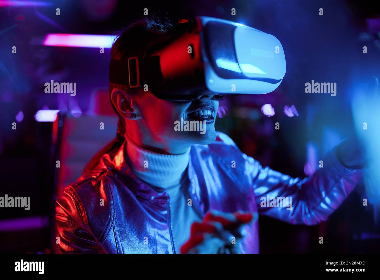 Neon metaverse futuristic concept. happy stylish woman in vr headset ...