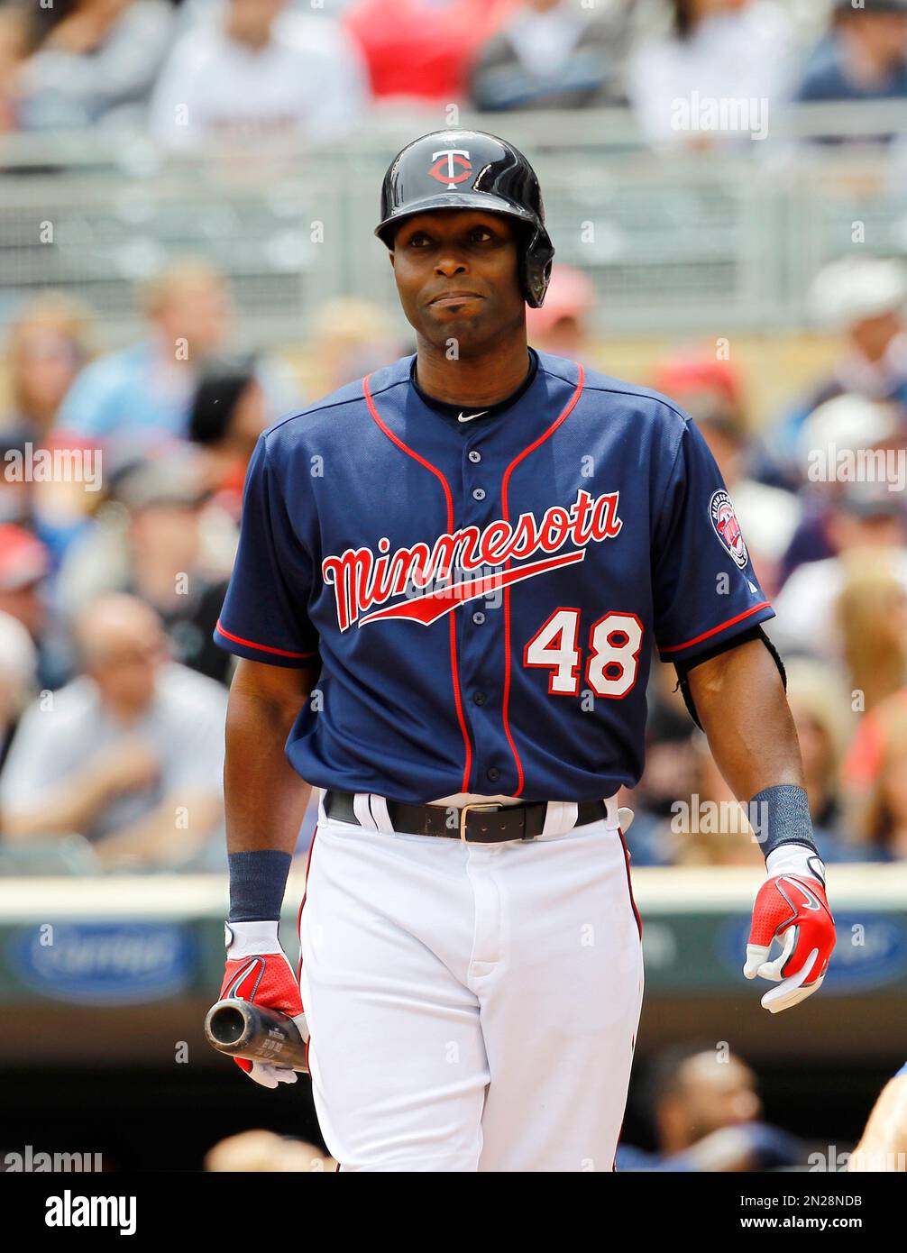 Minnesota Twins' Torii Hunter (48) looks to third base coach Gene Glynn ...