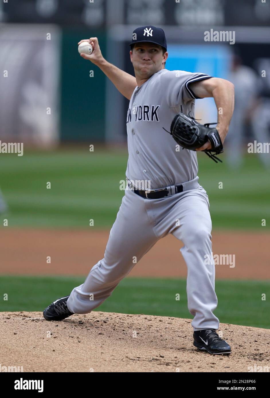 New York Yankees' Adam Warren works against the Oakland Athletics in ...