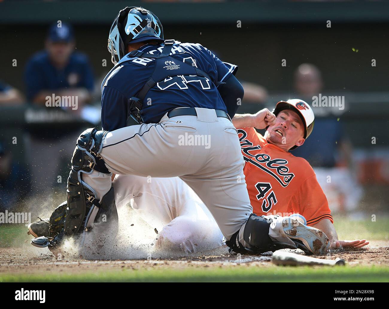 Baltimore Orioles Steve Clevenger, right, is tagged out by Tampa Bay ...