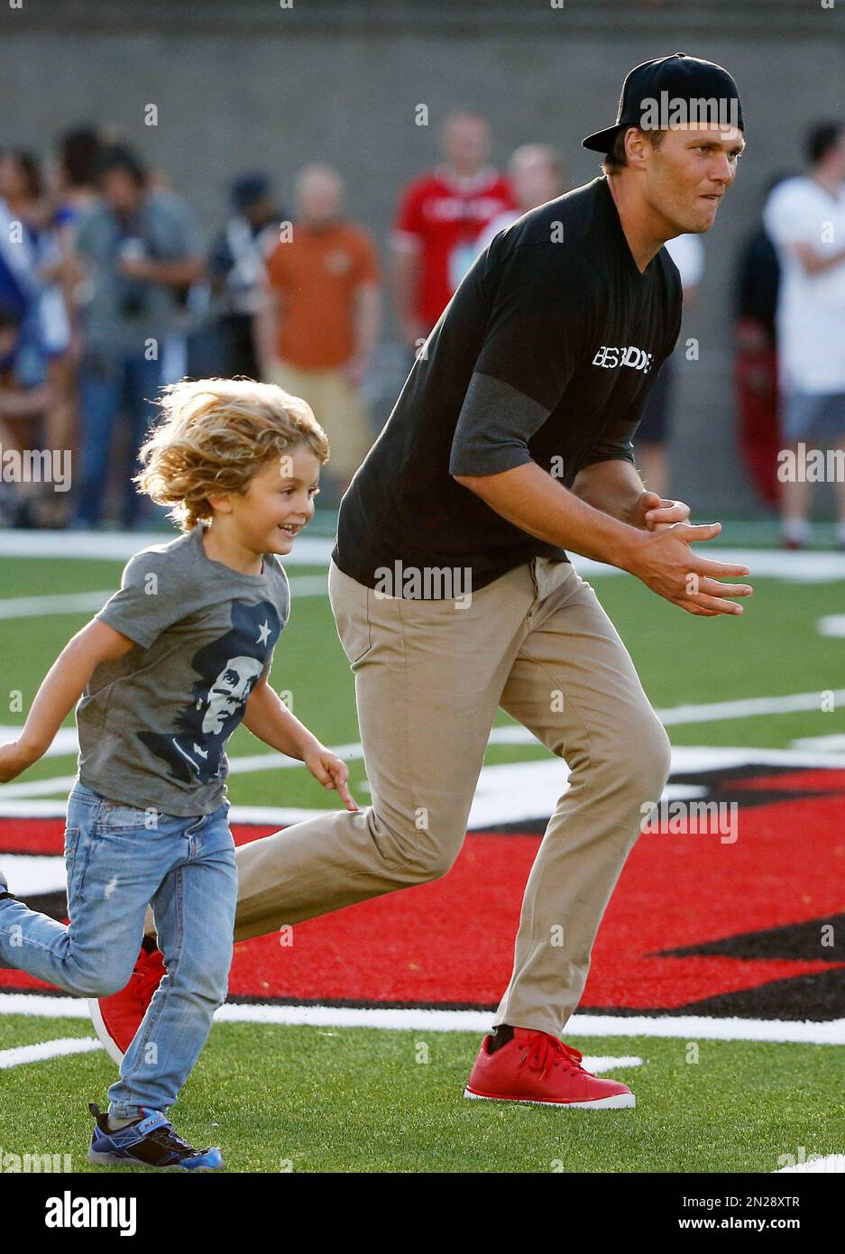 Joseph Shriver, left, son of Anthony Kennedy Shriver, runs alongside ...