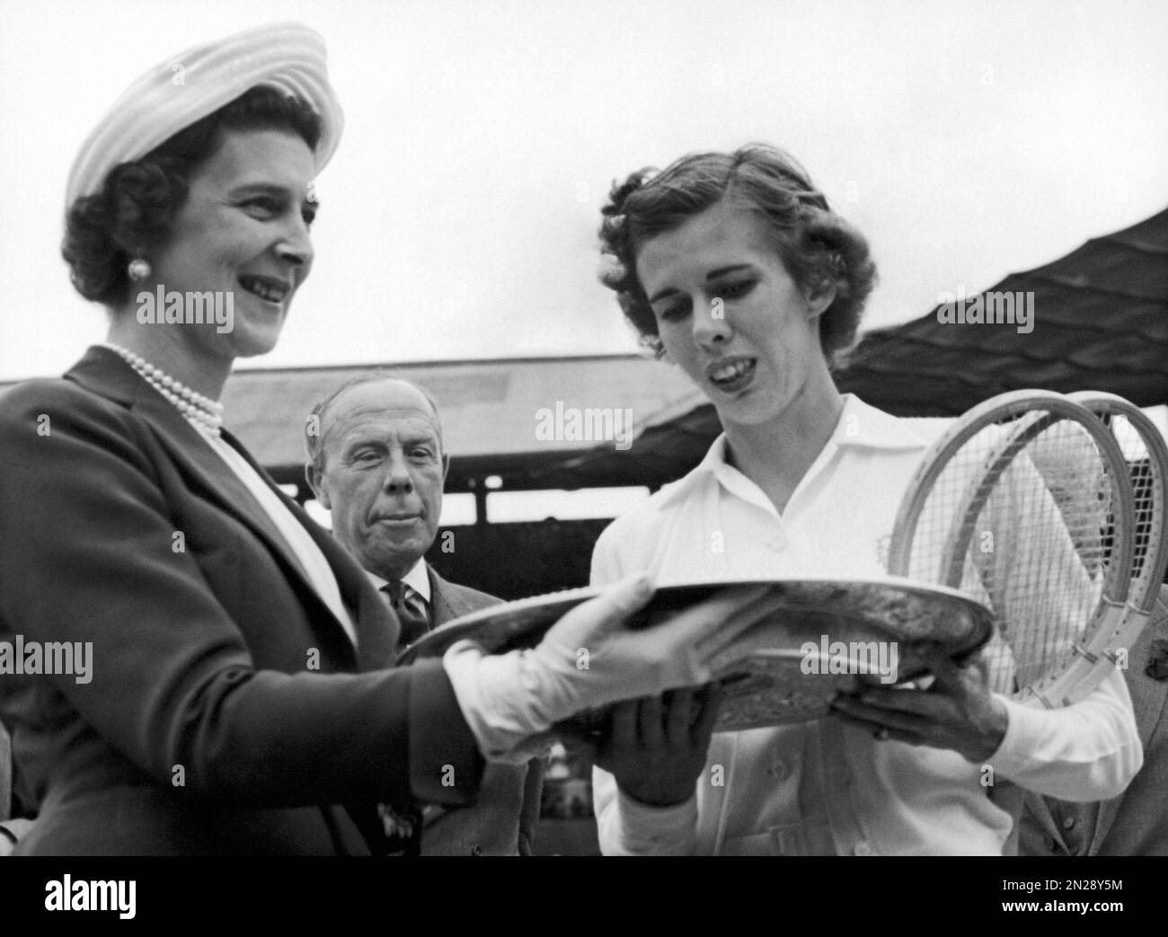 FILE - In this July 7, 1951, file photo, Doris Hart, right, receives ...