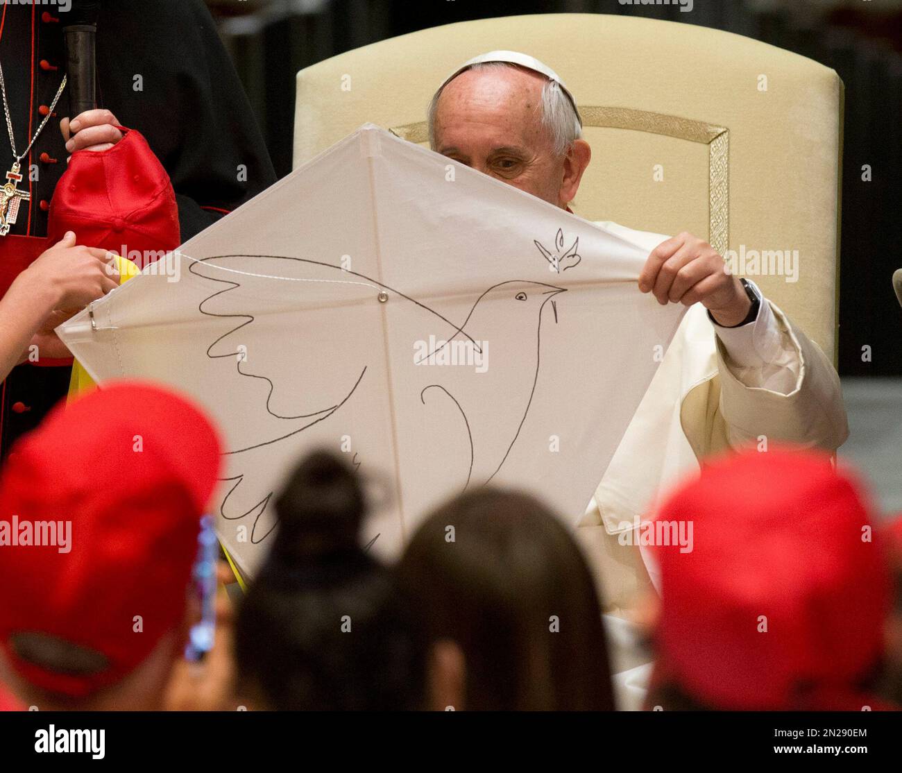 Pope Francis is presented with a kite as he meets children of inmates ...