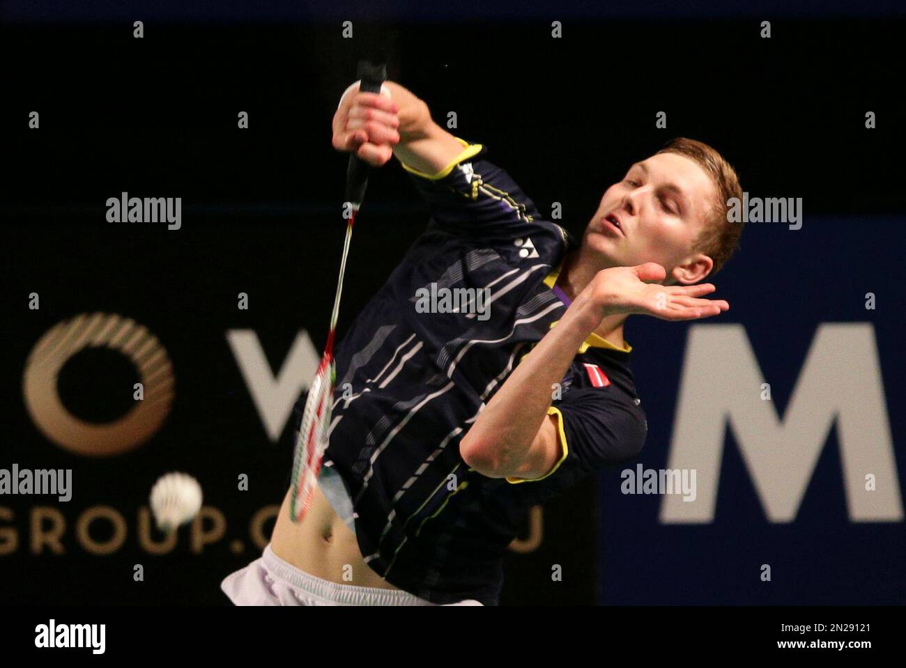 Viktor Axelsen of Denmark returns a shot during his men's singles ...
