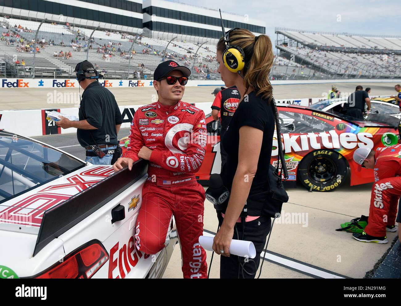 Kyle Larson, left, talks with Jamie Little, right, before qualifying ...