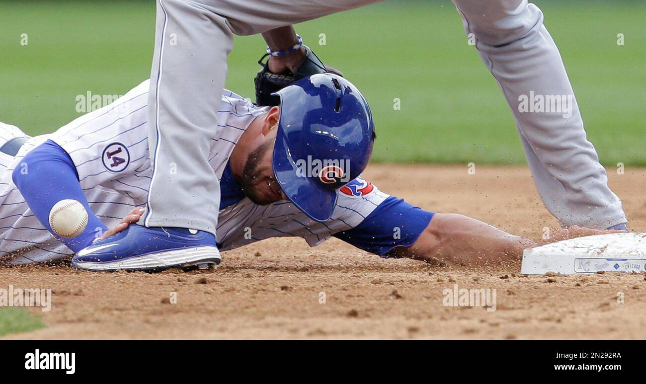 Chicago Cubs' Kris Bryant dives back safely into second base as Kansas ...