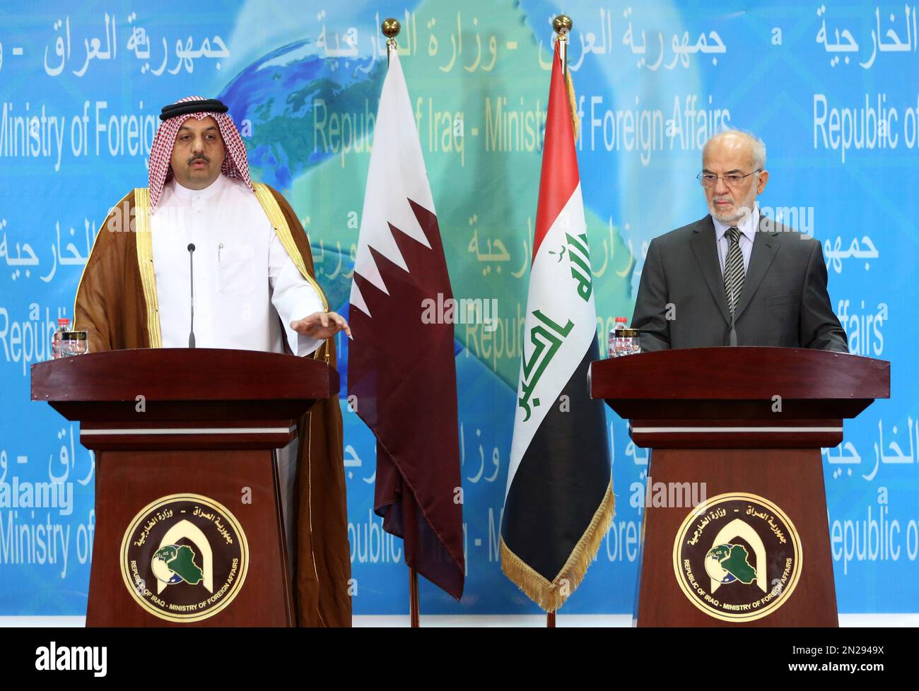 Qatari Foreign Minister Khalid bin Mohammed al-Attiyah, left, speaks ...