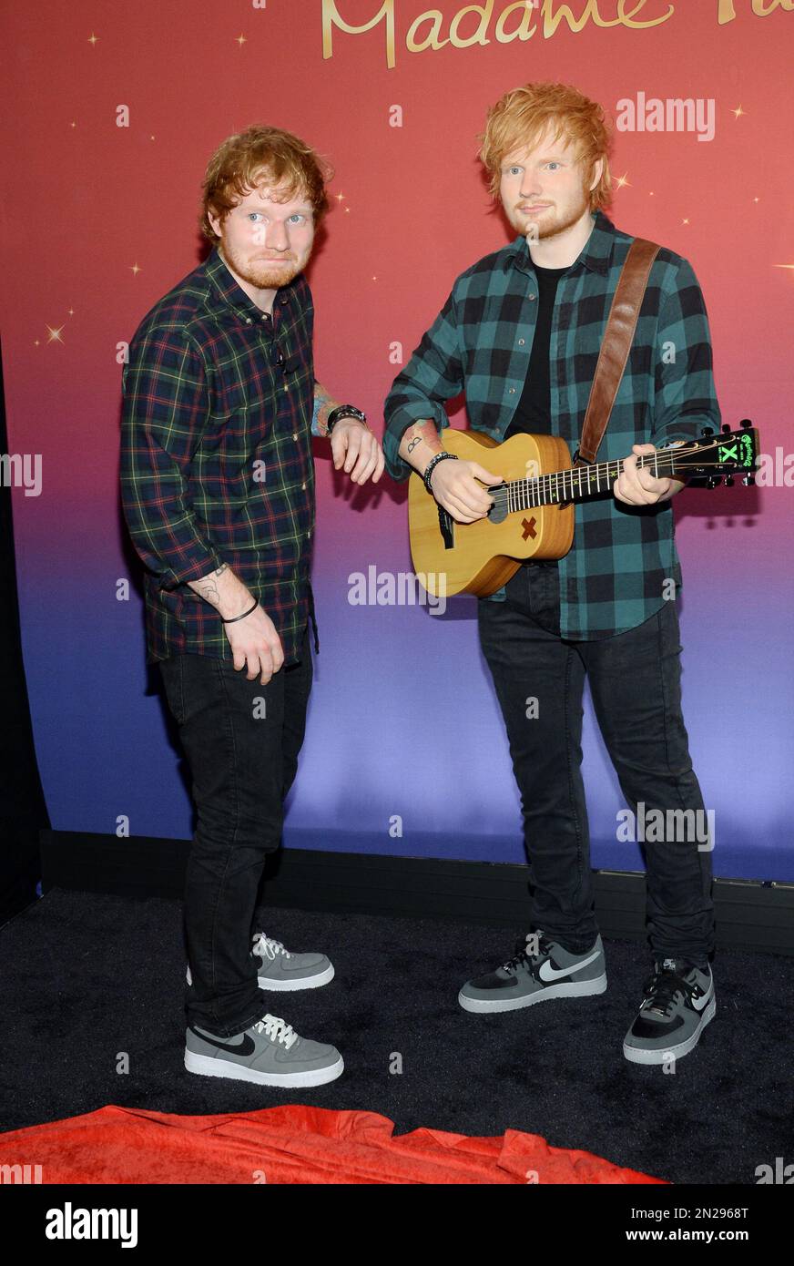 Singer Ed Sheeran, left, unveils his wax figure at Madame Tussauds on ...