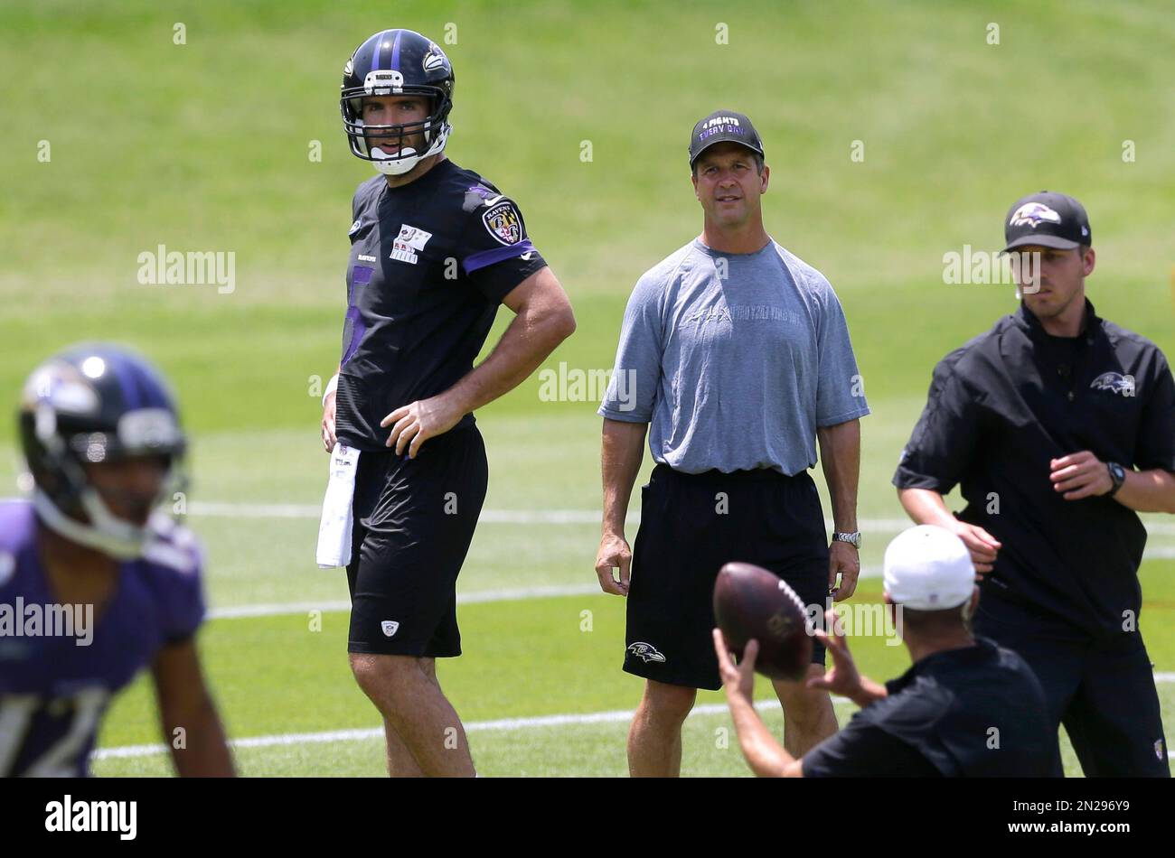 Baltimore Ravens quarterback Joe Flacco, left, and head coach John ...
