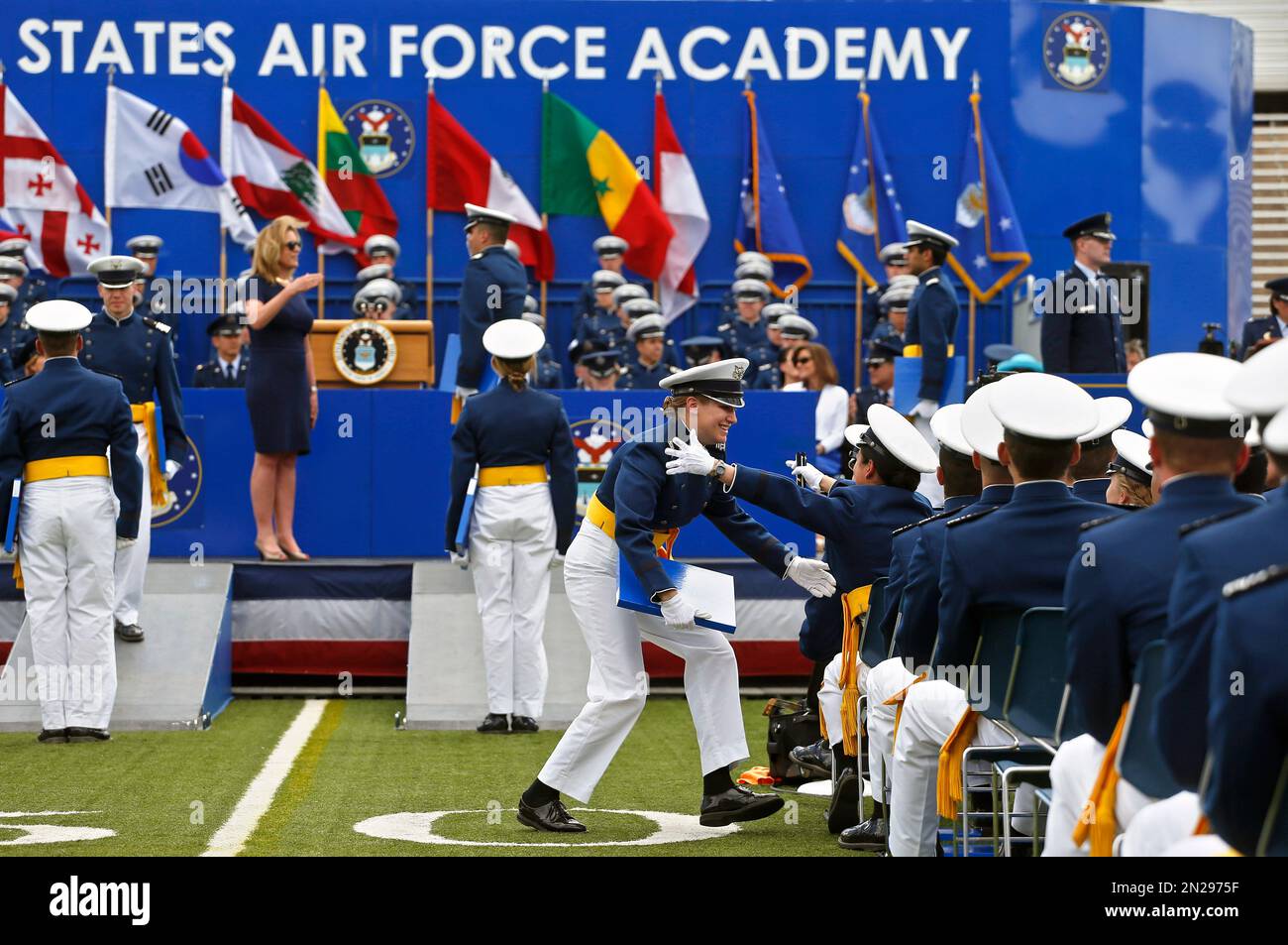 Graduating Air Force Academy cadets hug as they receive diplomas during ...