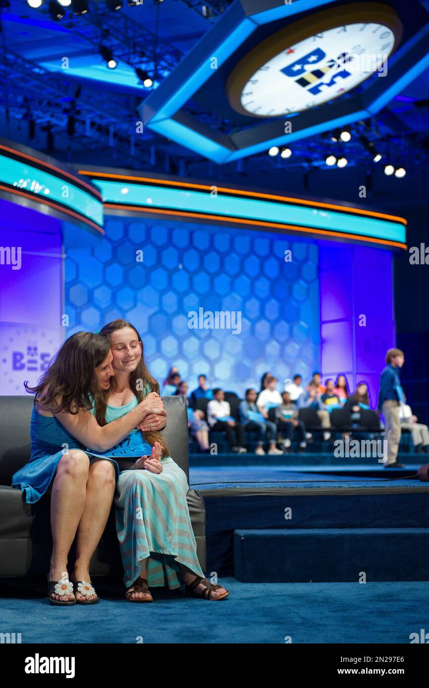 Lily Mears, 13, of Grand Rapids, Mich., right, is comforted by her ...