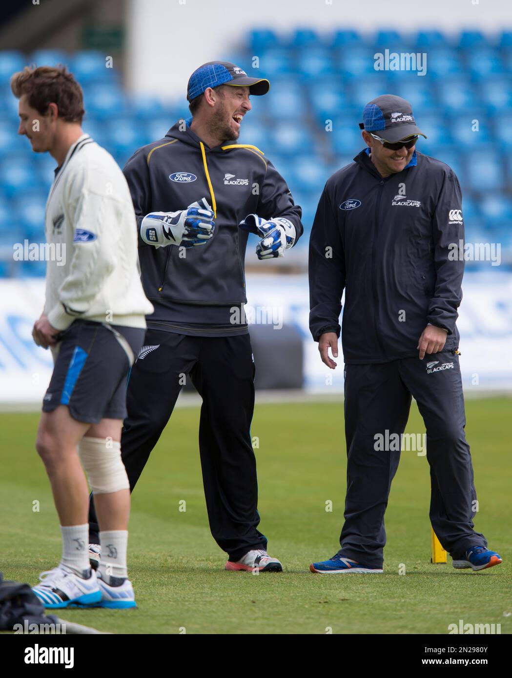 New Zealand's Luke Ronchi, centre, laughs as he stands alongside ...