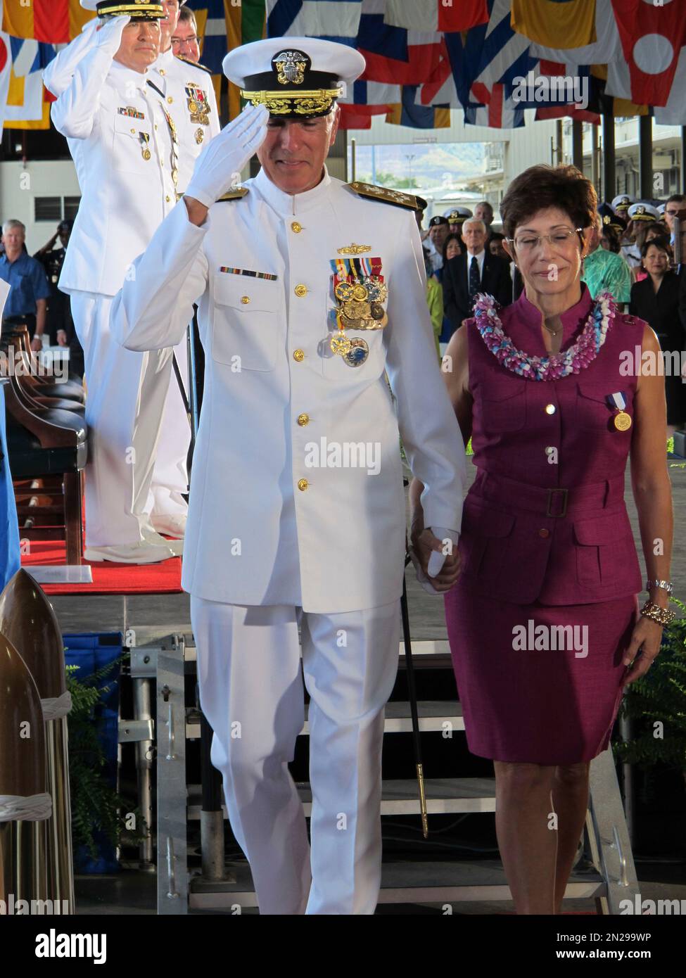 Adm. Samuel Locklear, left, salutes as he and his wife Pamela Locklear ...