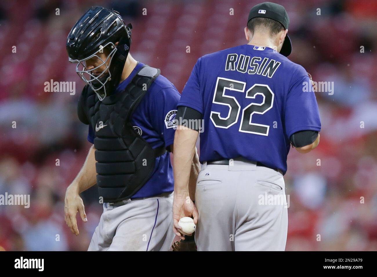 Colorado Rockies relief pitcher Chris Rusin (52) and catcher Nick ...