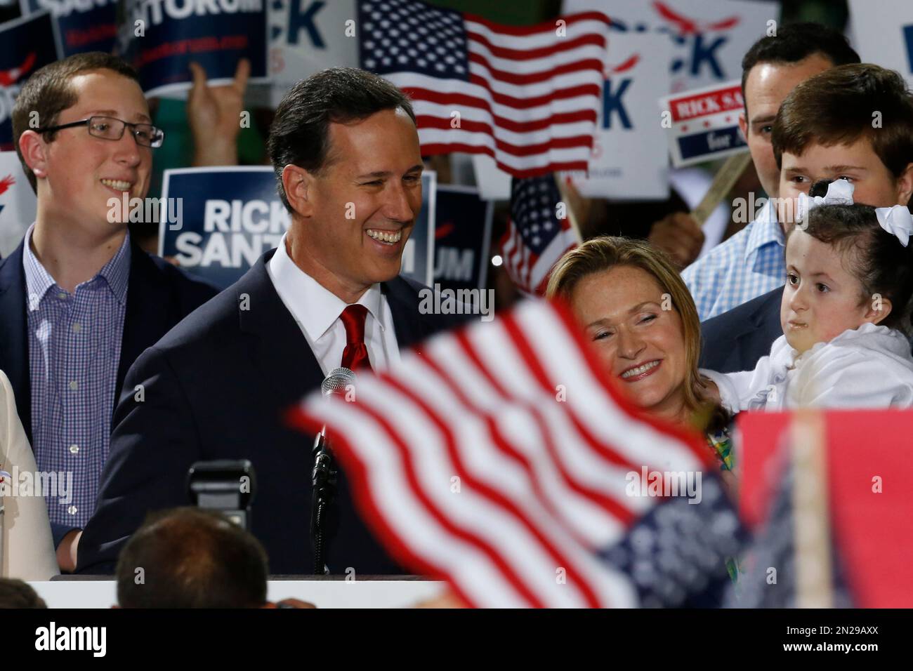 Former U.S. Sen. Rick Santorum, center, stands with his family as he ...
