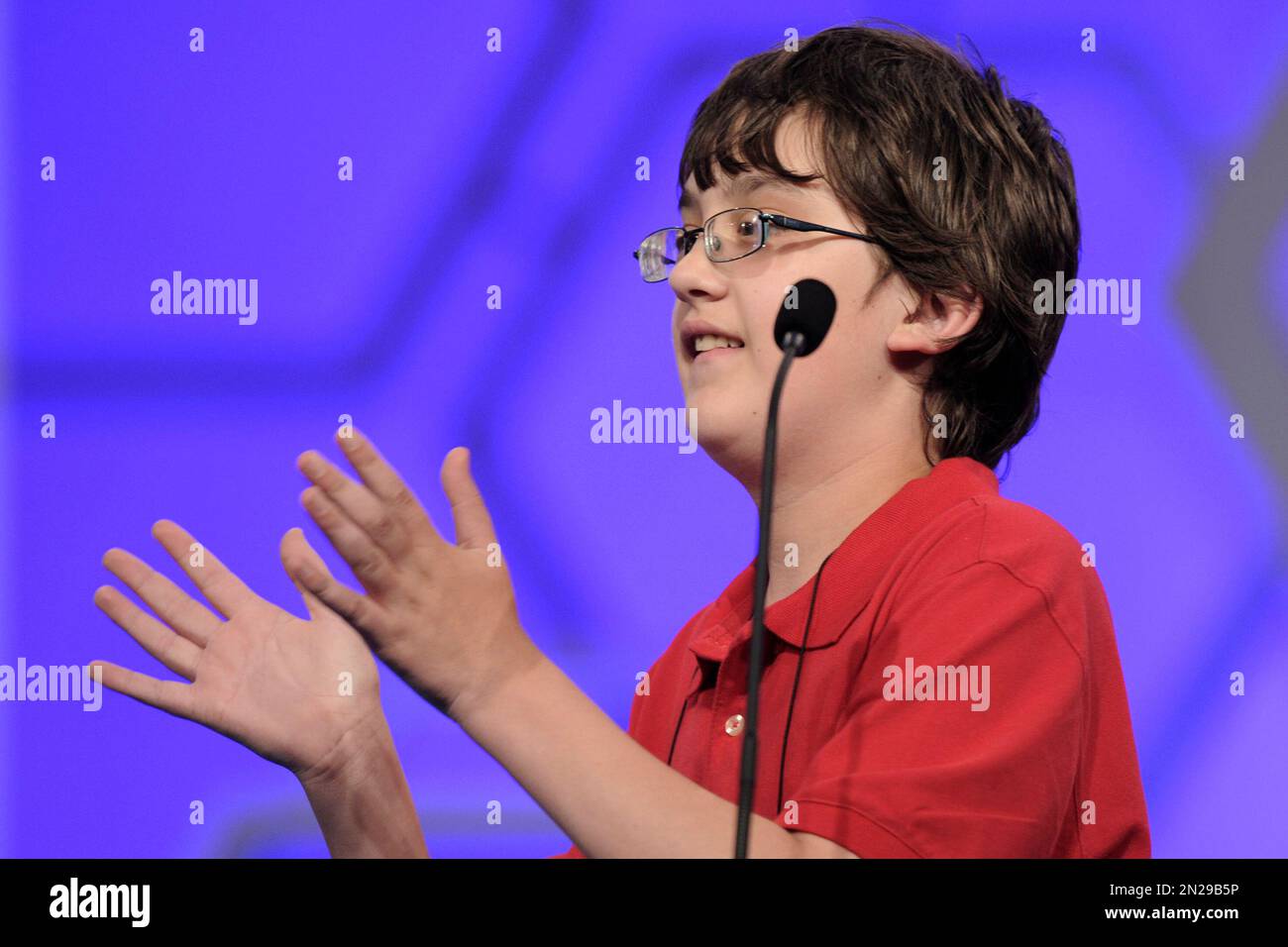 Andrew France, 13, of Cleveland, applauds after correctly spelling the ...