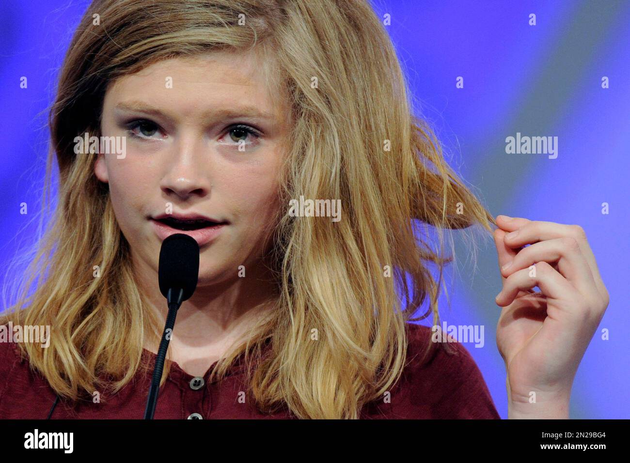 Hailey Hogenson, 13, of Ludington, Mich., pulls on her hair as she ...