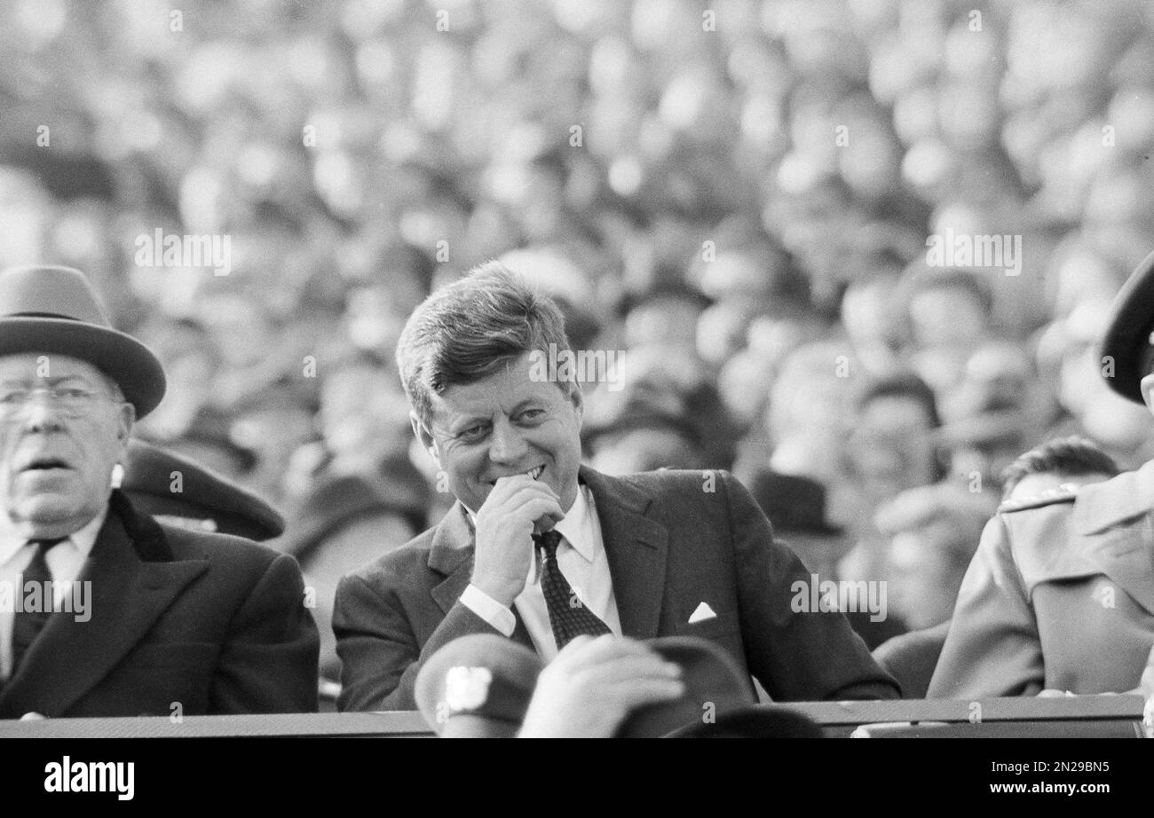 President John F. Kennedy smiles as he watches the annual Army-Navy ...