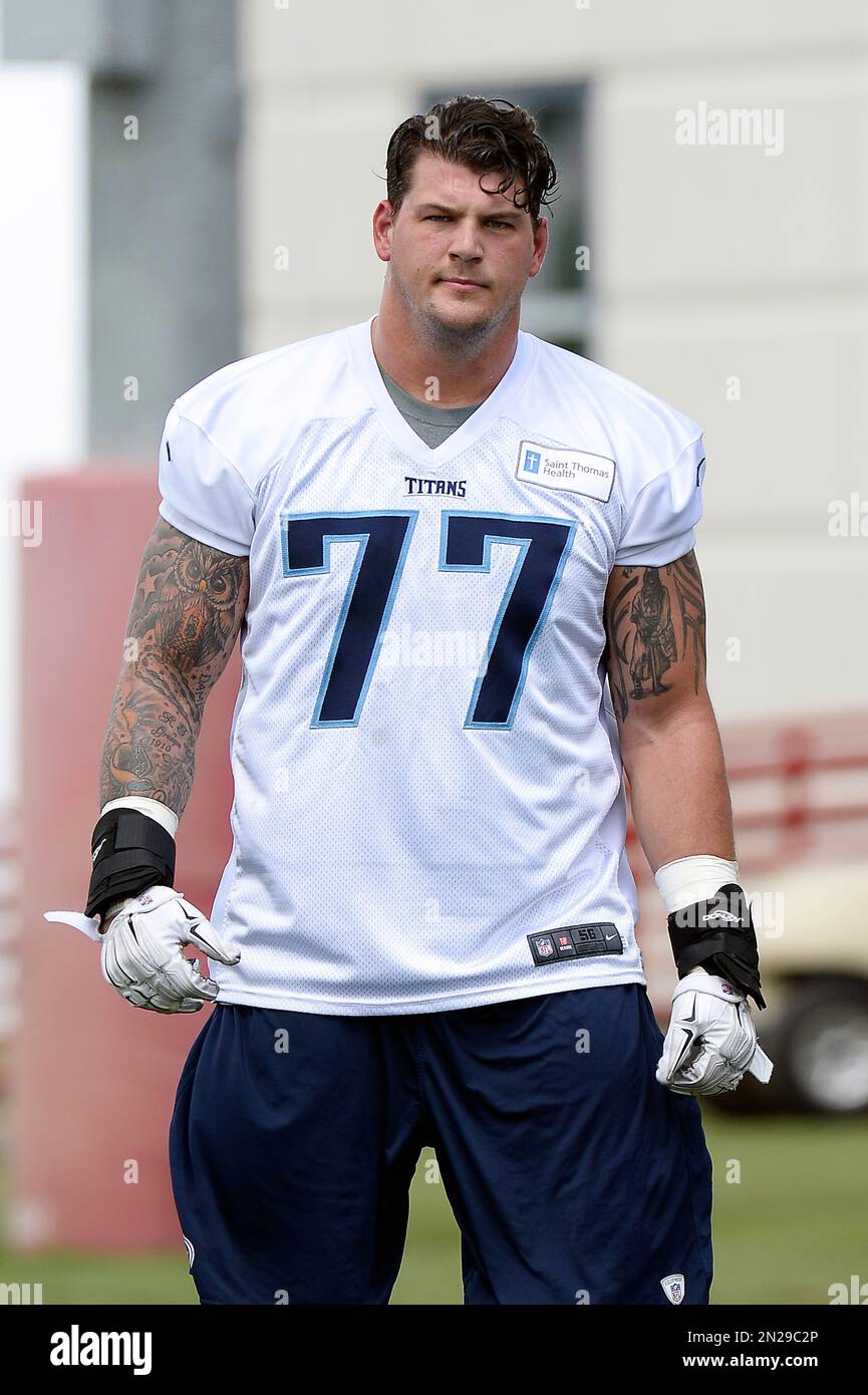 Tennessee Titans tackle Taylor Lewan takes a break during an organized ...