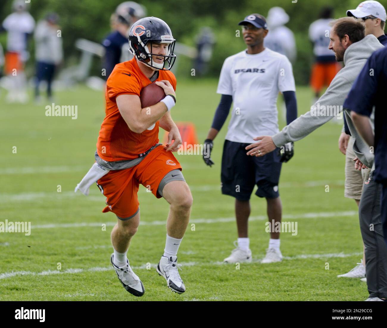 Chicago Bears offensive coordinator Adam Gase, right, reaches out as ...