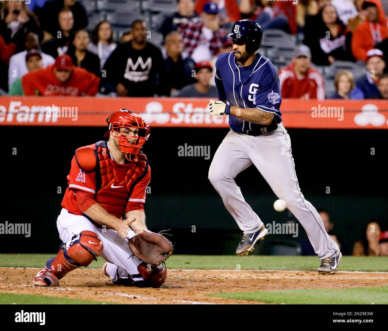 San Diego Padres' Matt Kemp, right, scores past Los Angeles Angels ...