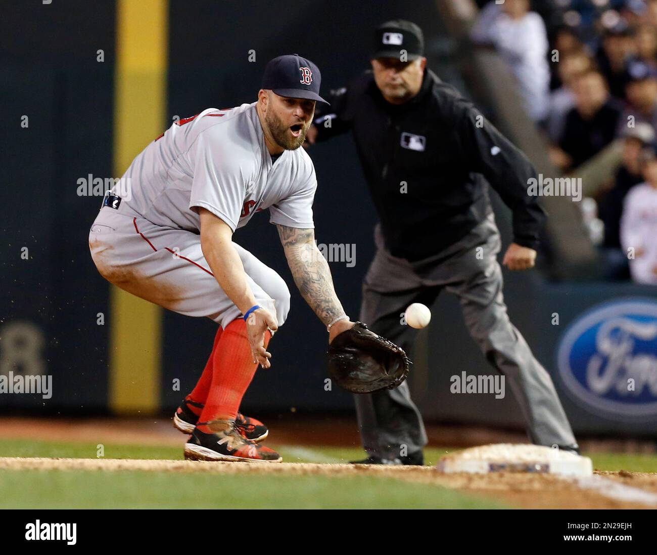 Boston Red Sox first baseman Mike Napoli waits for the ball as ...