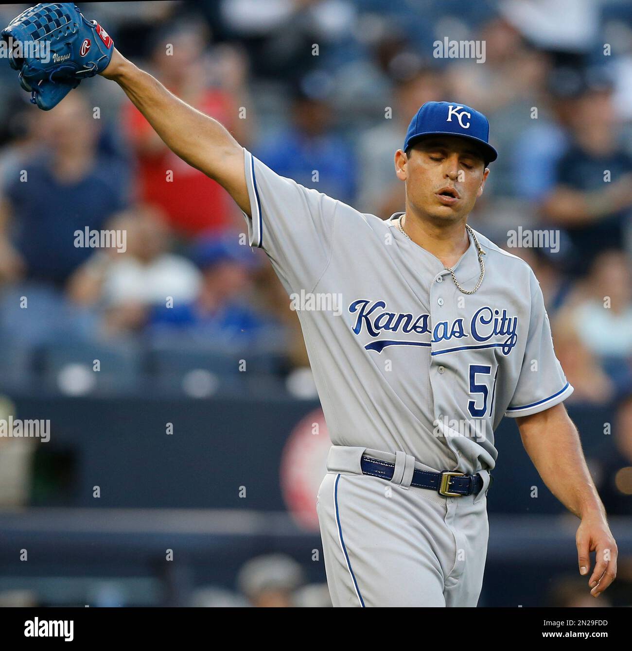 Kansas City Royals starting pitcher Jason Vargas reacts after allowing ...