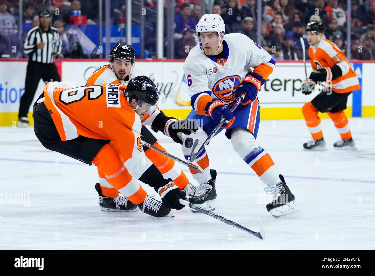 Philadelphia Flyers' Travis Sanheim, left, and New York Islanders' Ryan ...