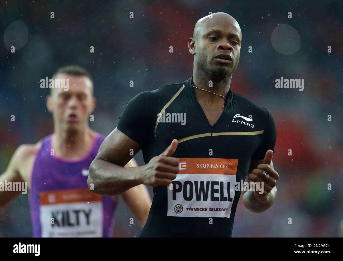 Asafa Powell of Jamaica crosses the finish line to win the men's 100 ...