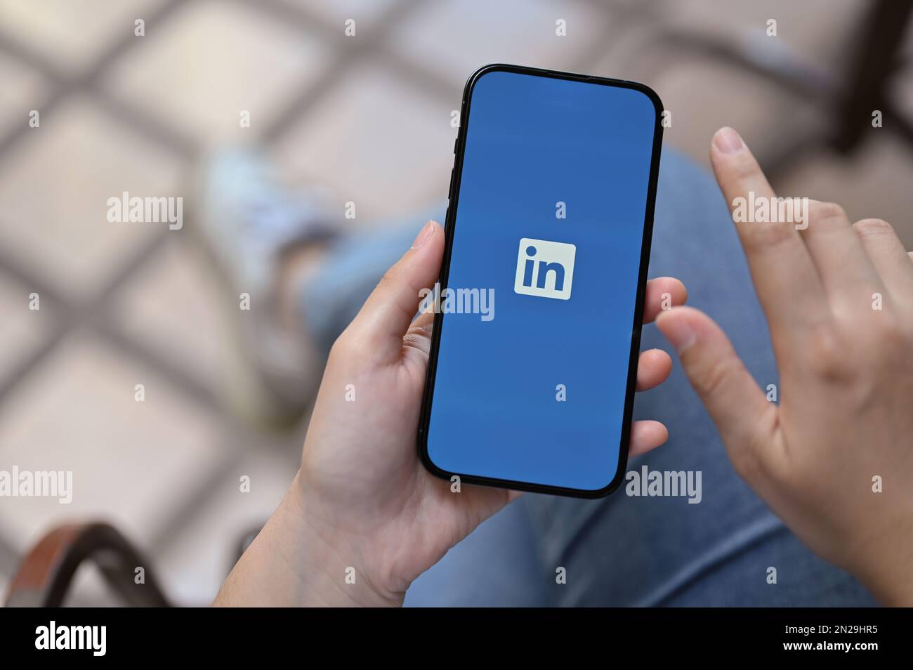 Chiang Mai, Thailand - Feb 6 2023: Top view of a female hands holding a ...