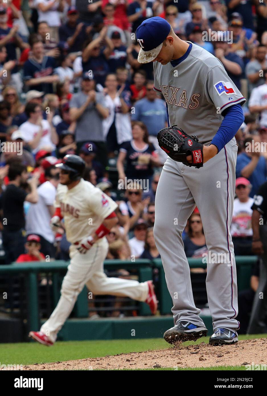 Texas Rangers pitcher Phil Klein looks down after giving up a three-run ...