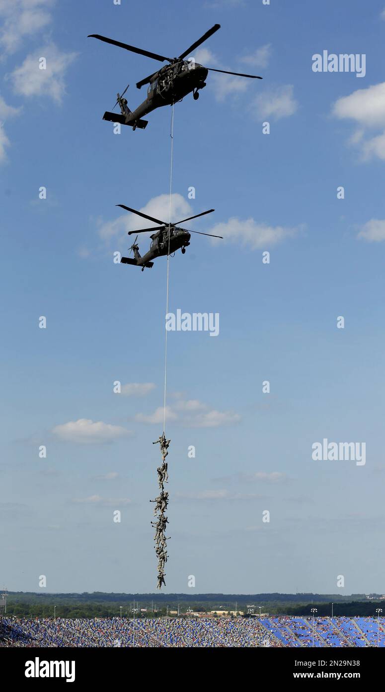 An Army repel team is extracted by a Black Hawk helicopter during a ...