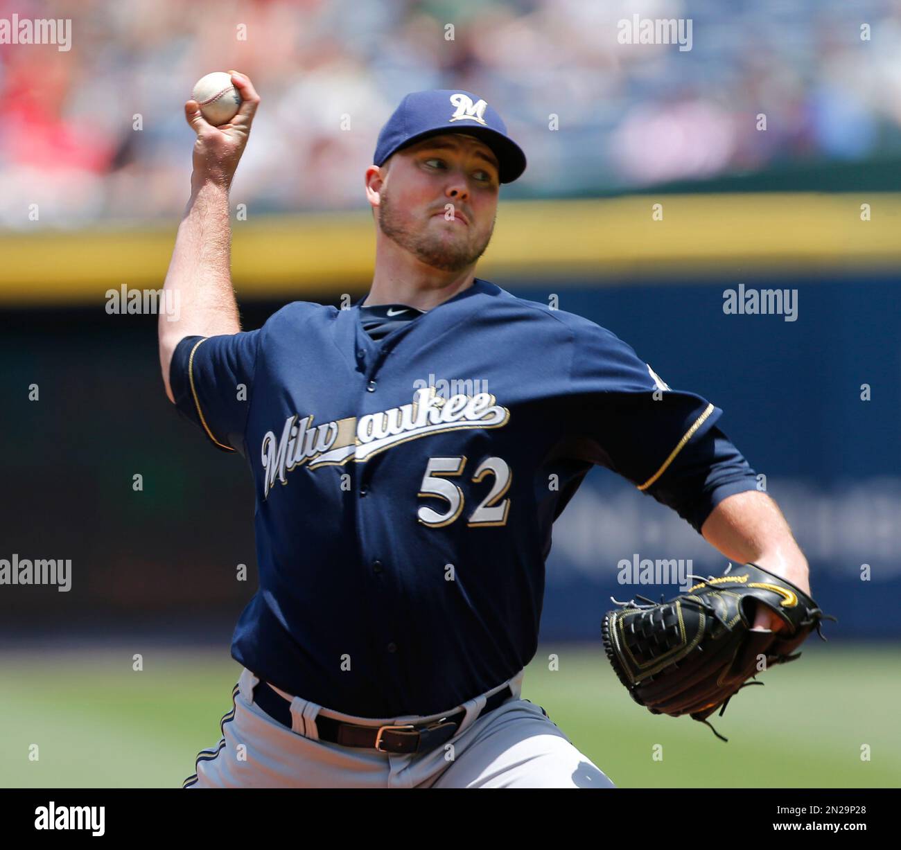 Milwaukee Brewers starting pitcher Jimmy Nelson (52) delivers in the ...