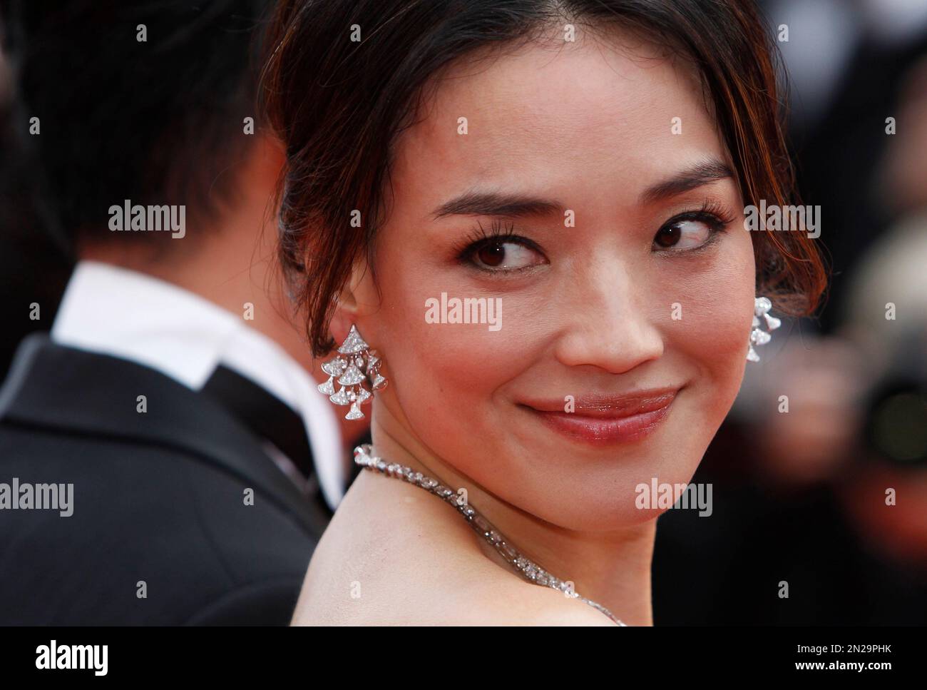 Actress Shu Qui poses for photographers upon arrival for the awards ...
