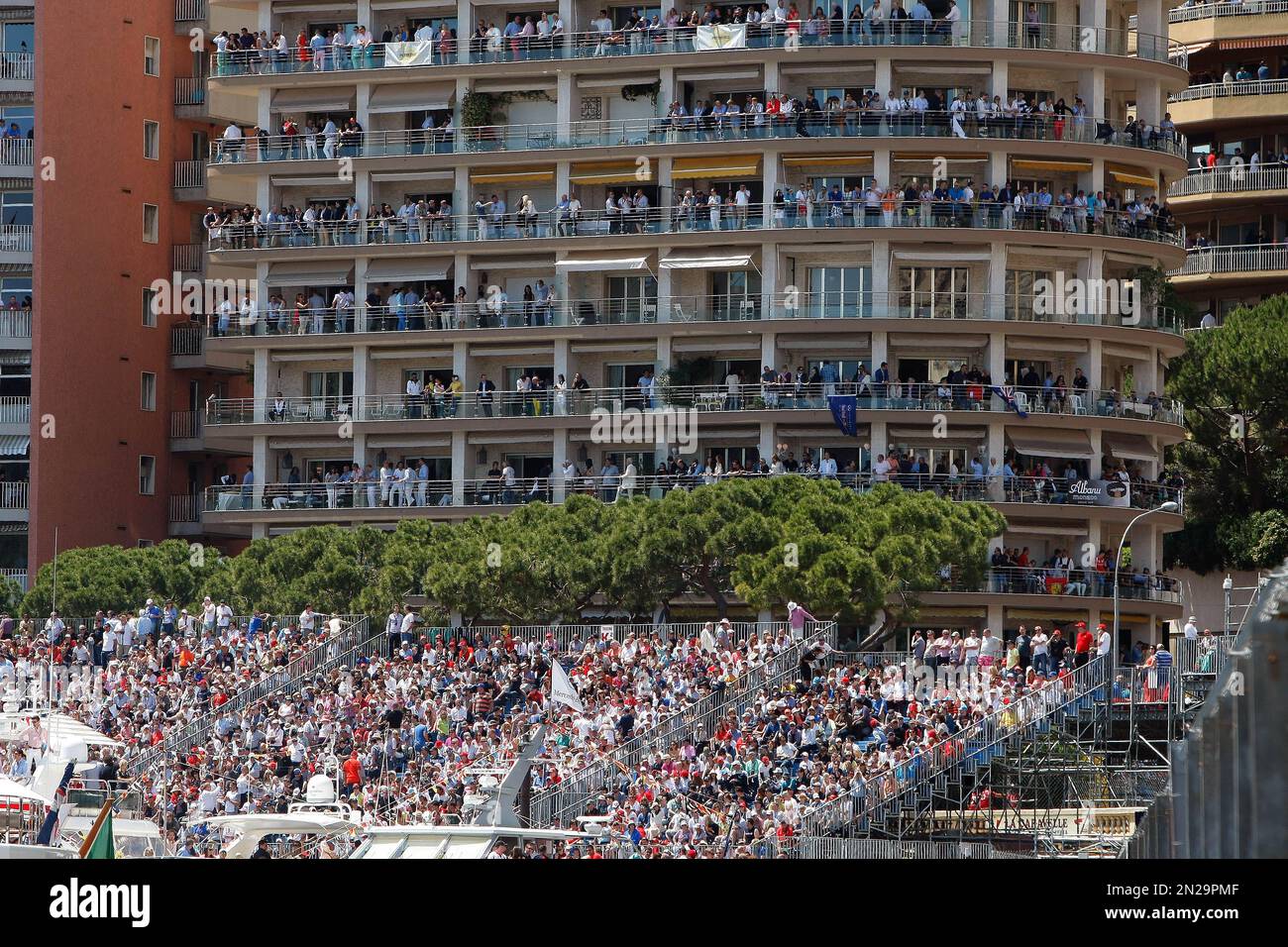 Spectators watch the Formula One Grand Prix from the stands and from ...