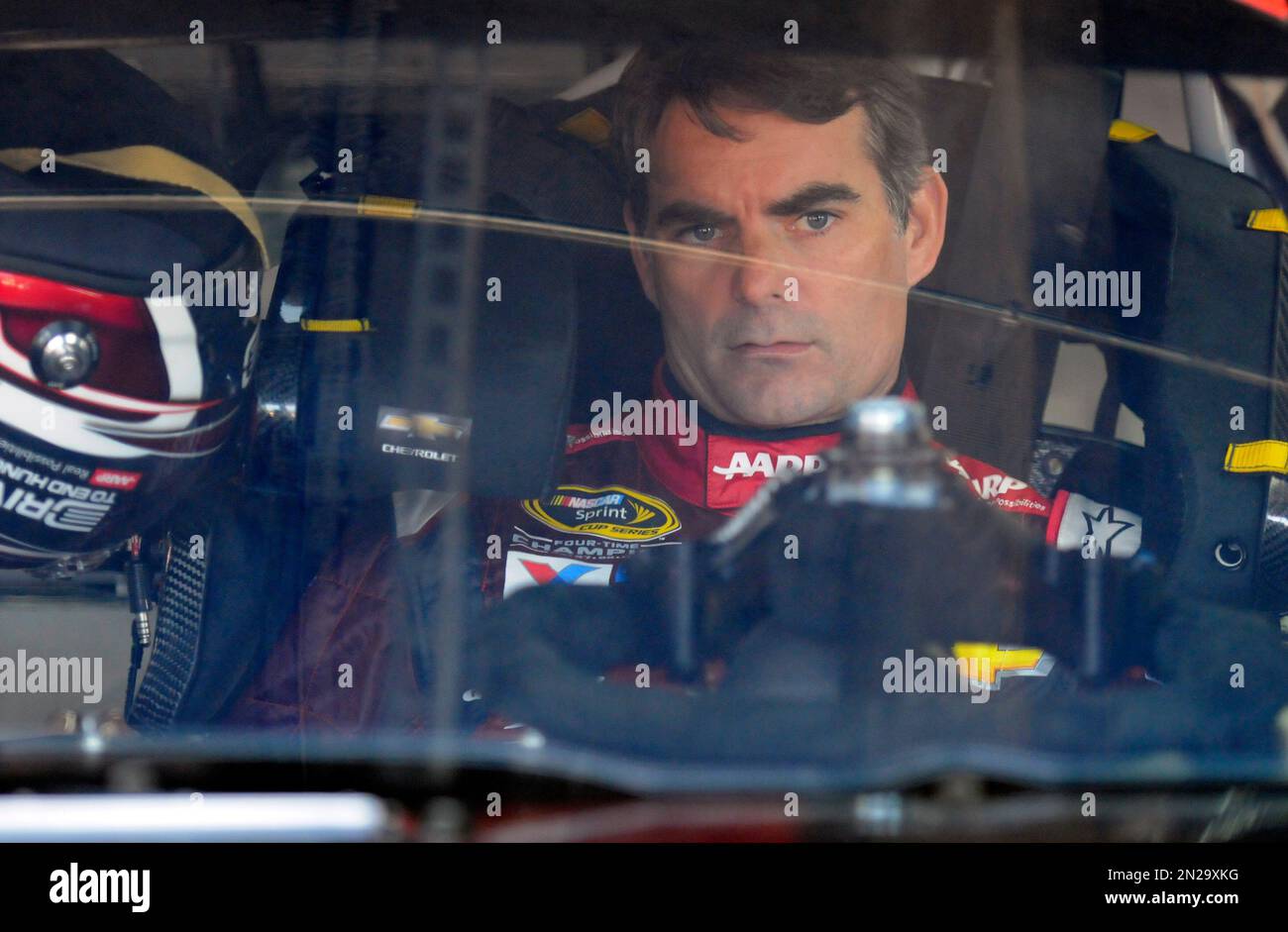 Jeff Gordon looks from his car before practice for Sunday's NASCAR Coca ...