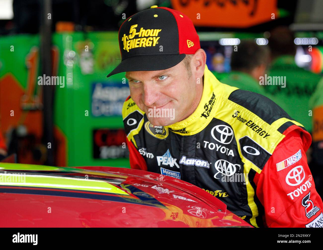 Clint Bowyer climbs into his car before practice for Sunday's NASCAR ...