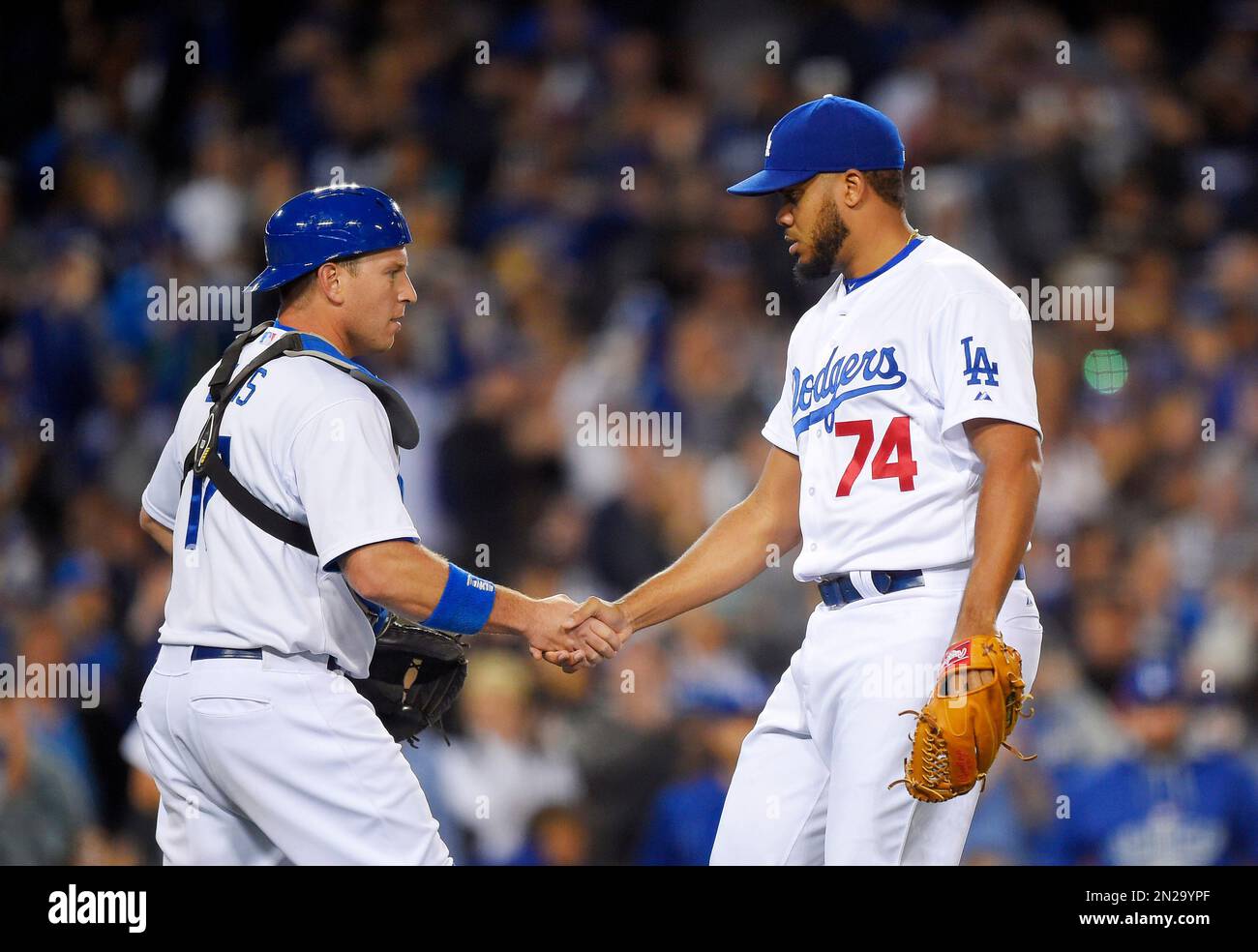 Los Angeles Dodgers catcher A.J. Ellis, left, and relief pitcher Kenley ...