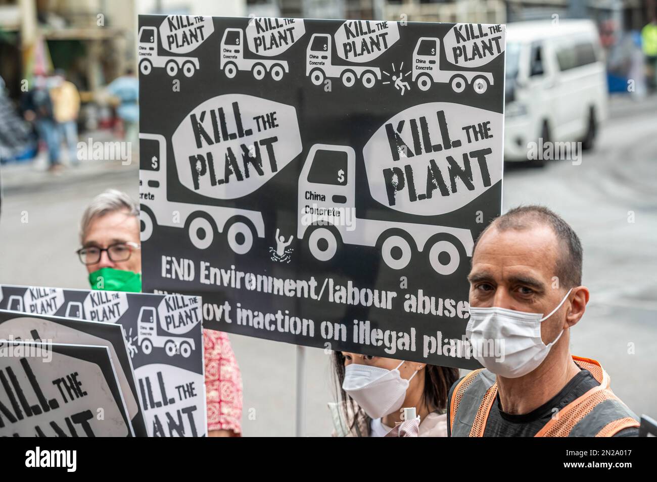 Surrounded by police and members of the media, James Ockenden (right ...