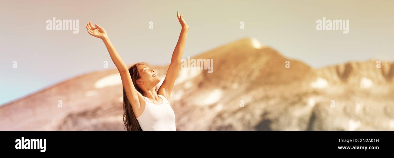 Happy free woman excited with arms up enjoying summer sunshine freedom ...