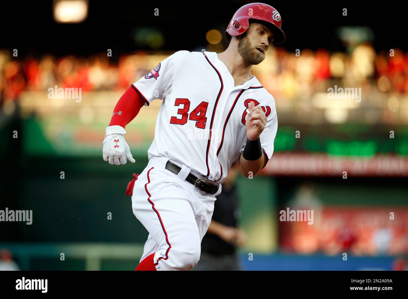 Washington Nationals' Bryce Harper rounds the bases for his solo home ...